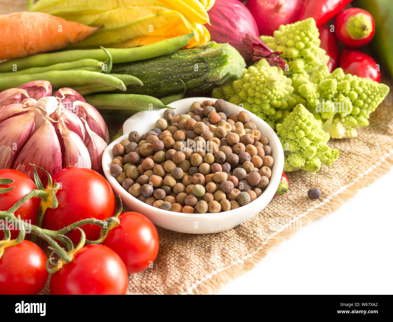 Raw organic roveja beans and vegetables isolated on white Stock Photo ...