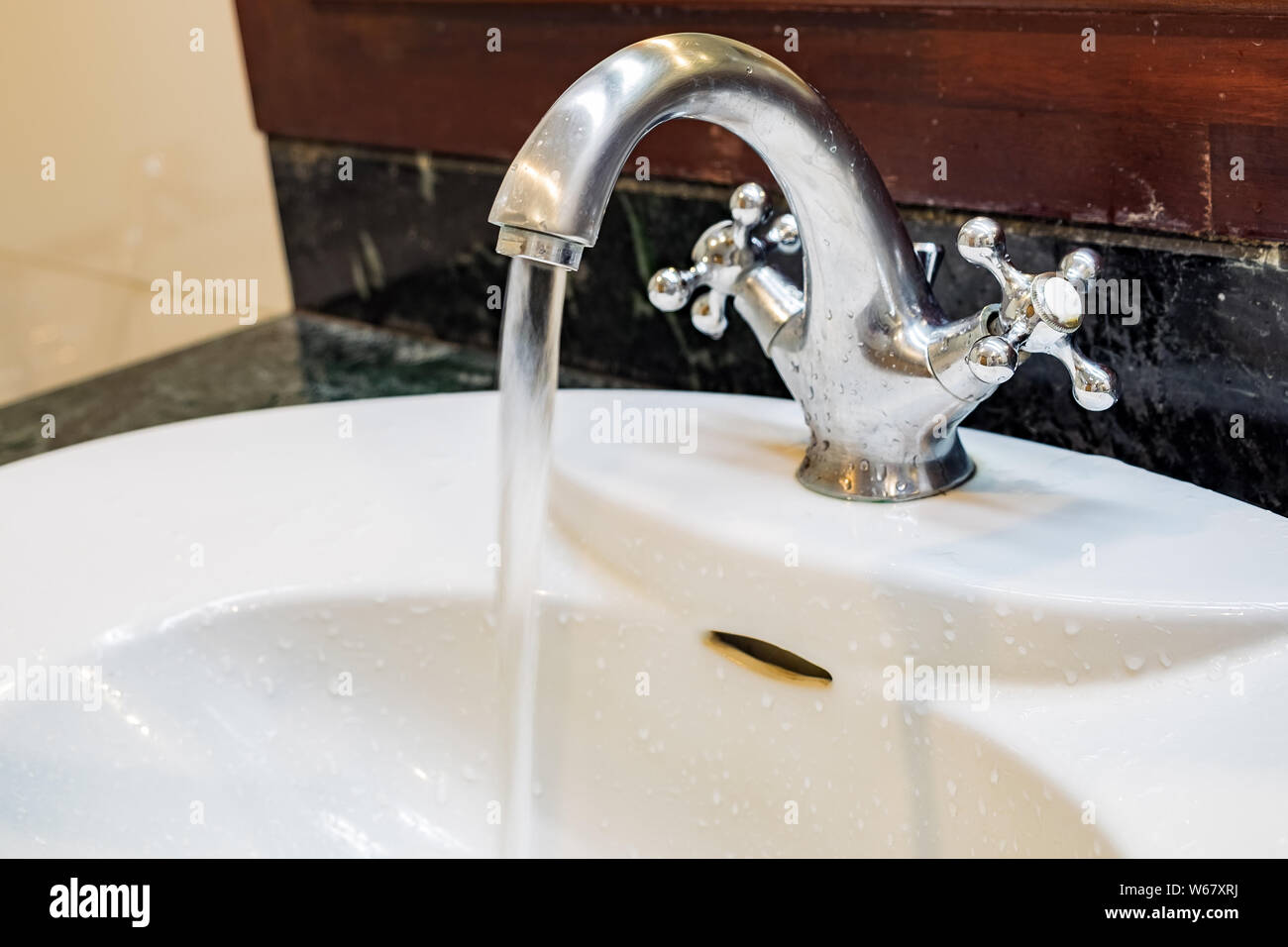 Sink white basin water flowing Stock Photo - Alamy