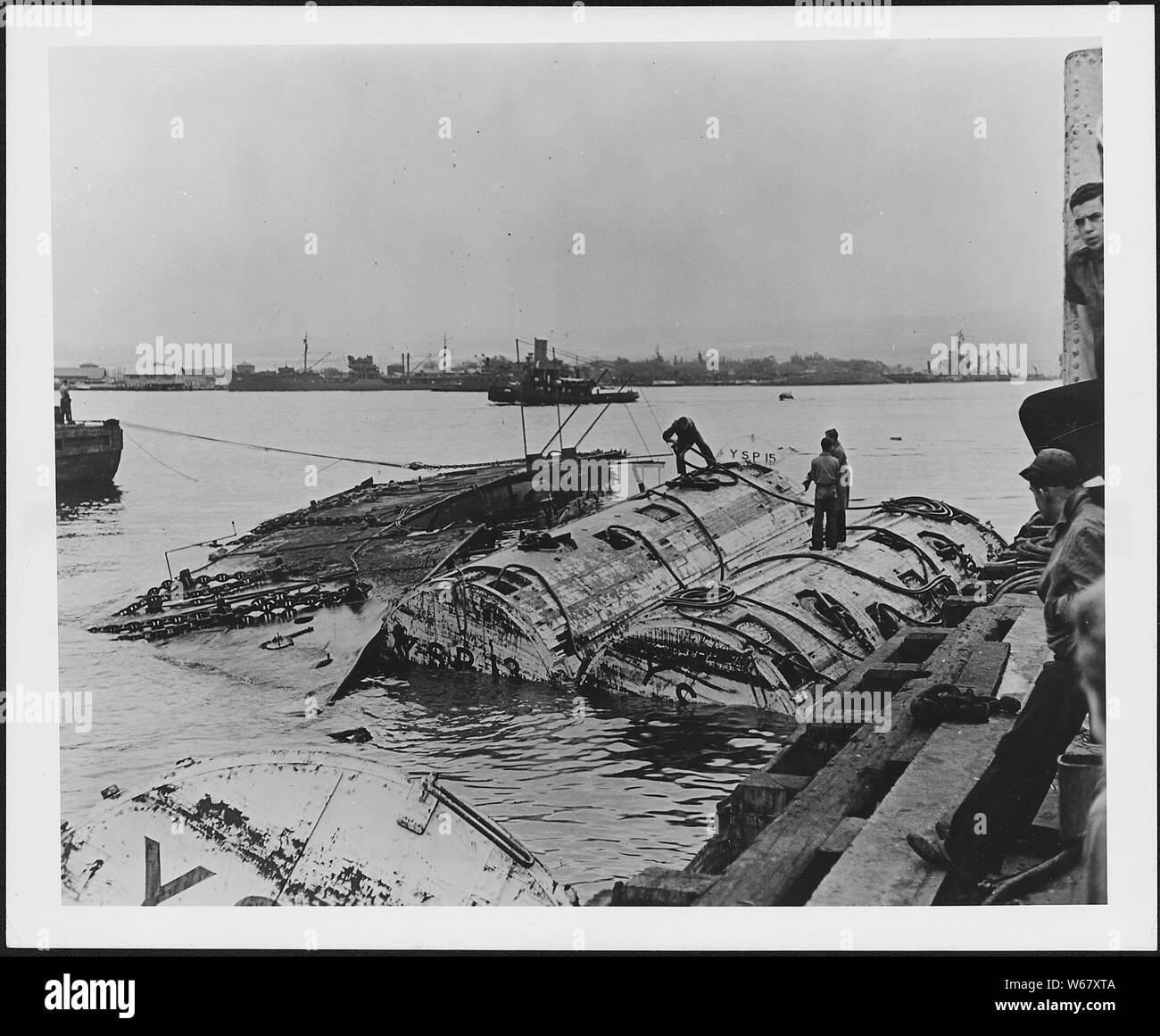 Photograph showing the capsized mine ship Oglala in Pearl Harbor Stock ...
