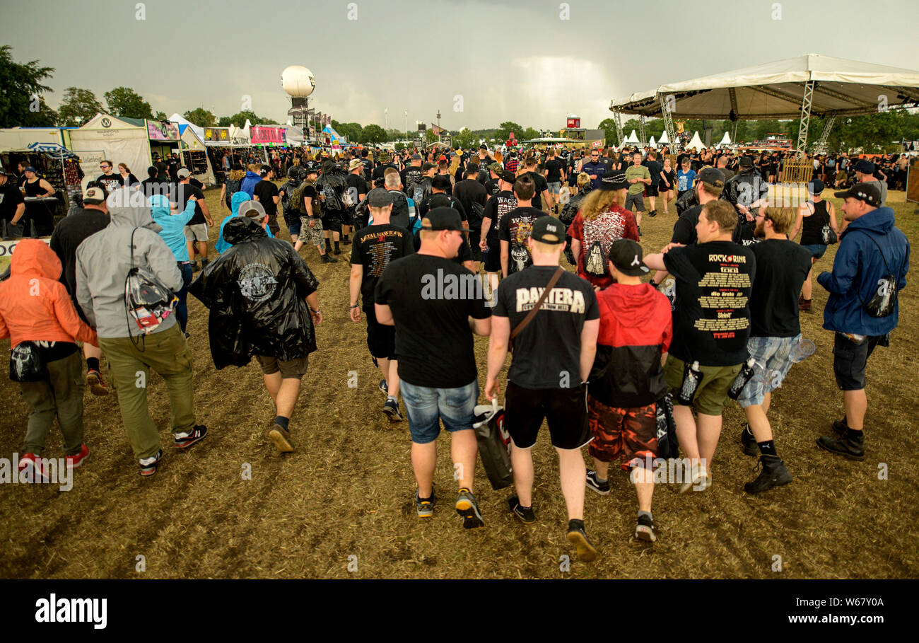 Wacken, Germany. 31st July, 2019. Visitors of the Wacken Open Air leave ...