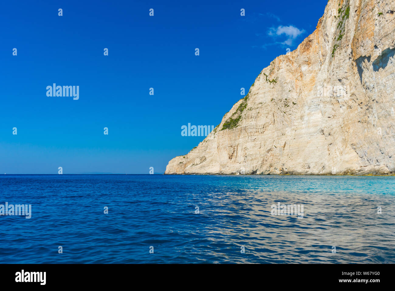 Greece, Zakynthos, Huge white cliff and beautiful blue ocean water at ...
