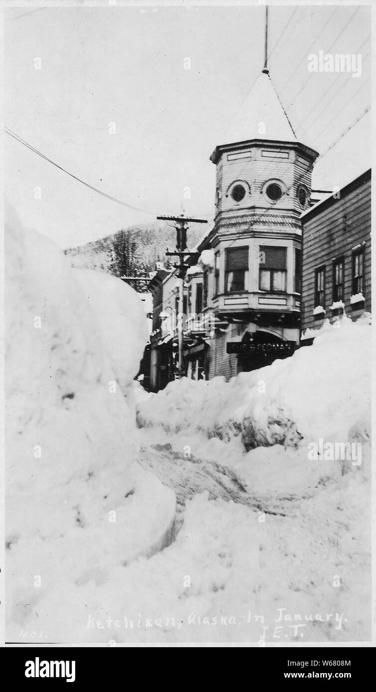 Post card. View of buildings through high snow banks in January ...