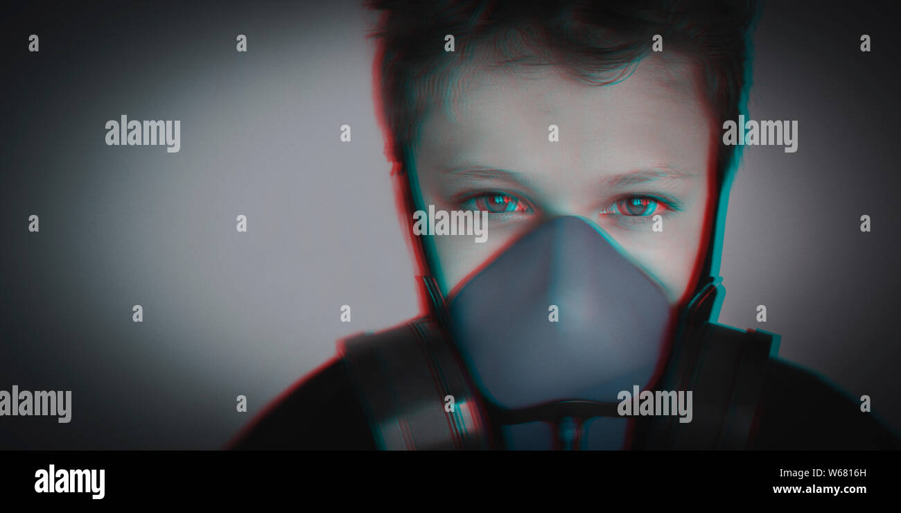 Young boy wearing gasmask, respirator portrait. Defocused effects of ...