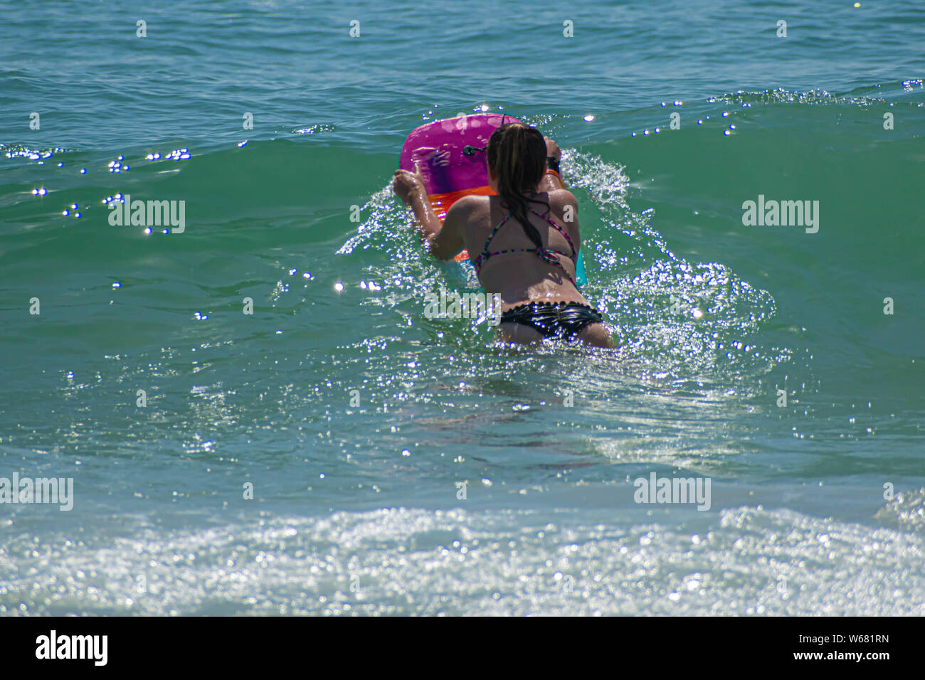 Daytona Beach Florida. July 07, 2019 Girl and boy with surfboard ...