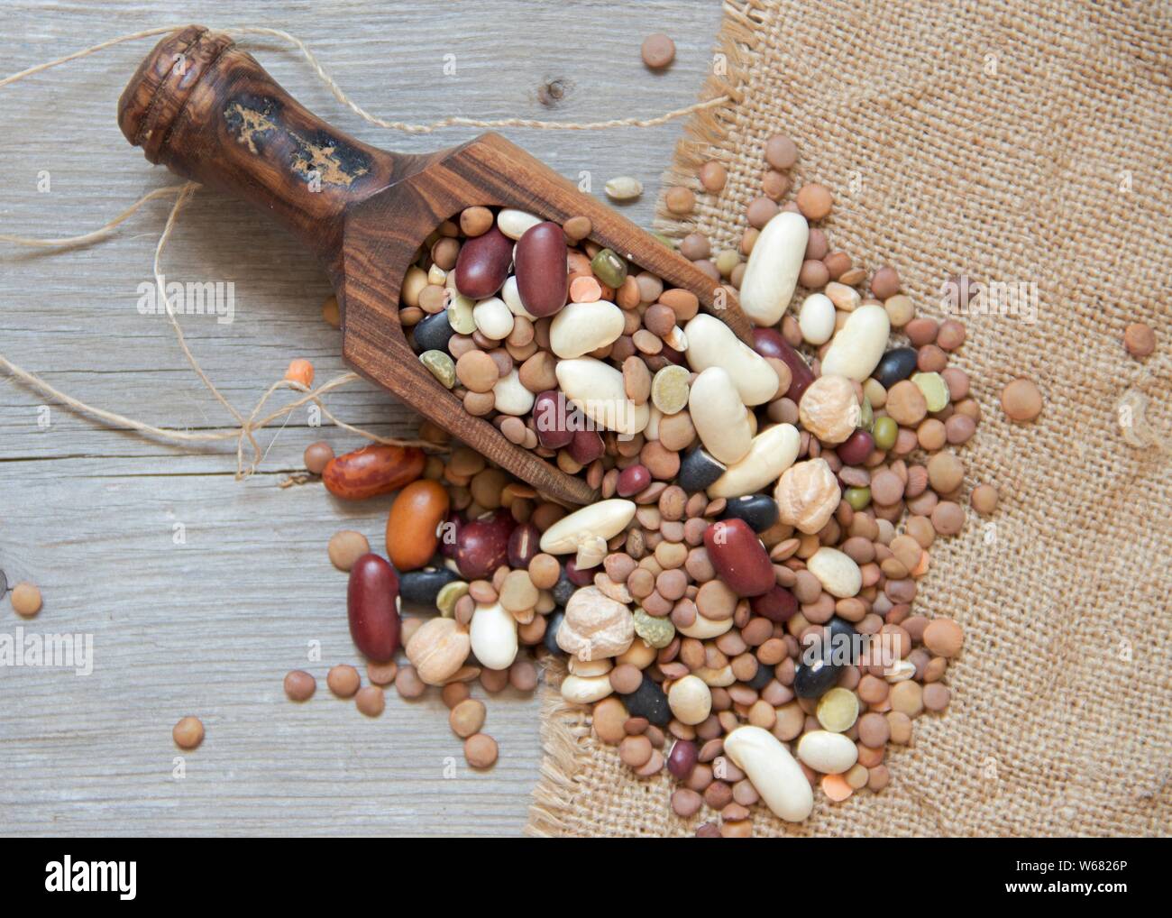 Legumes mix in the wood spoon Stock Photo - Alamy