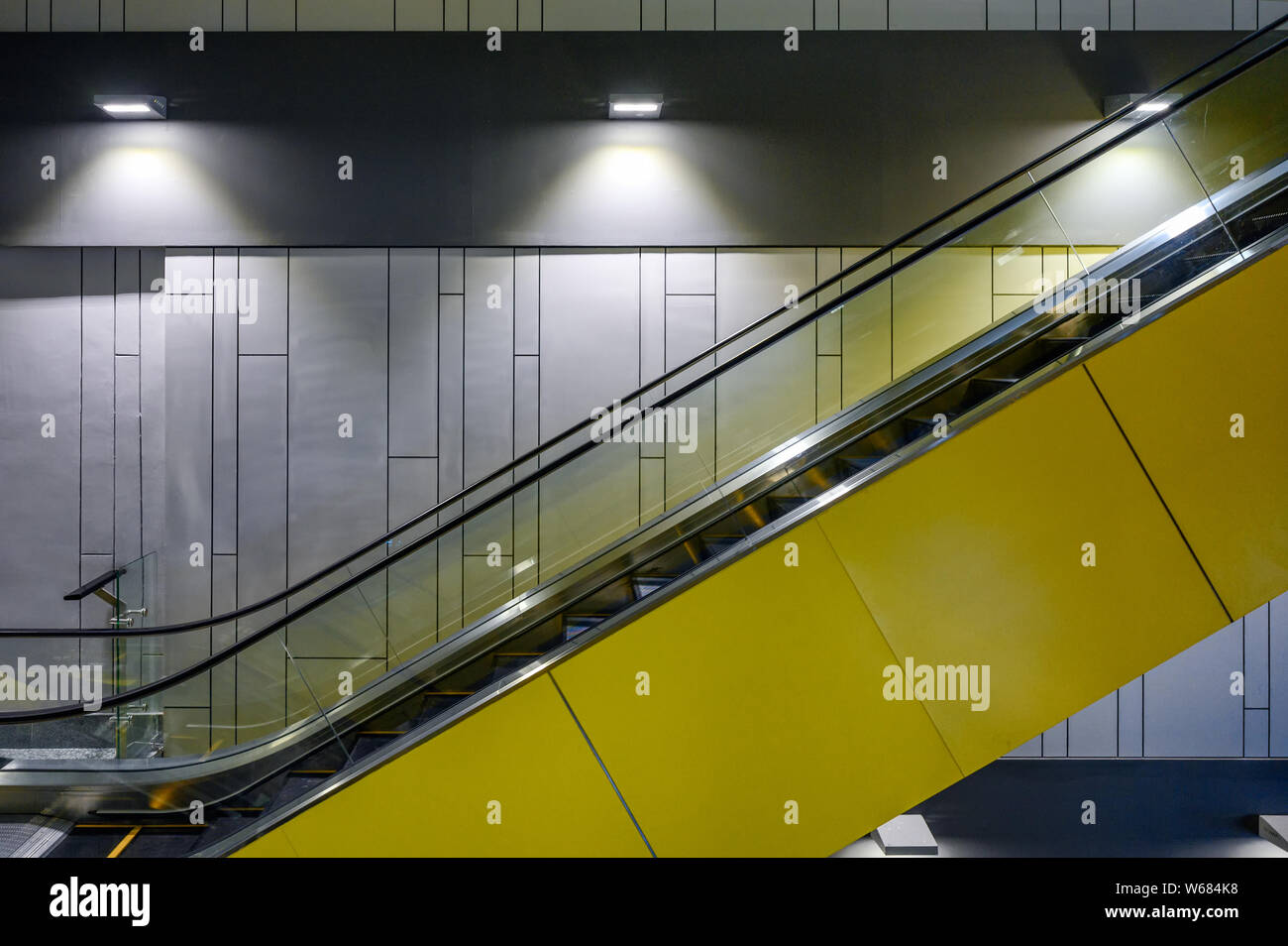 Beside yellow escalator with lamp lighting of modern interior Stock ...