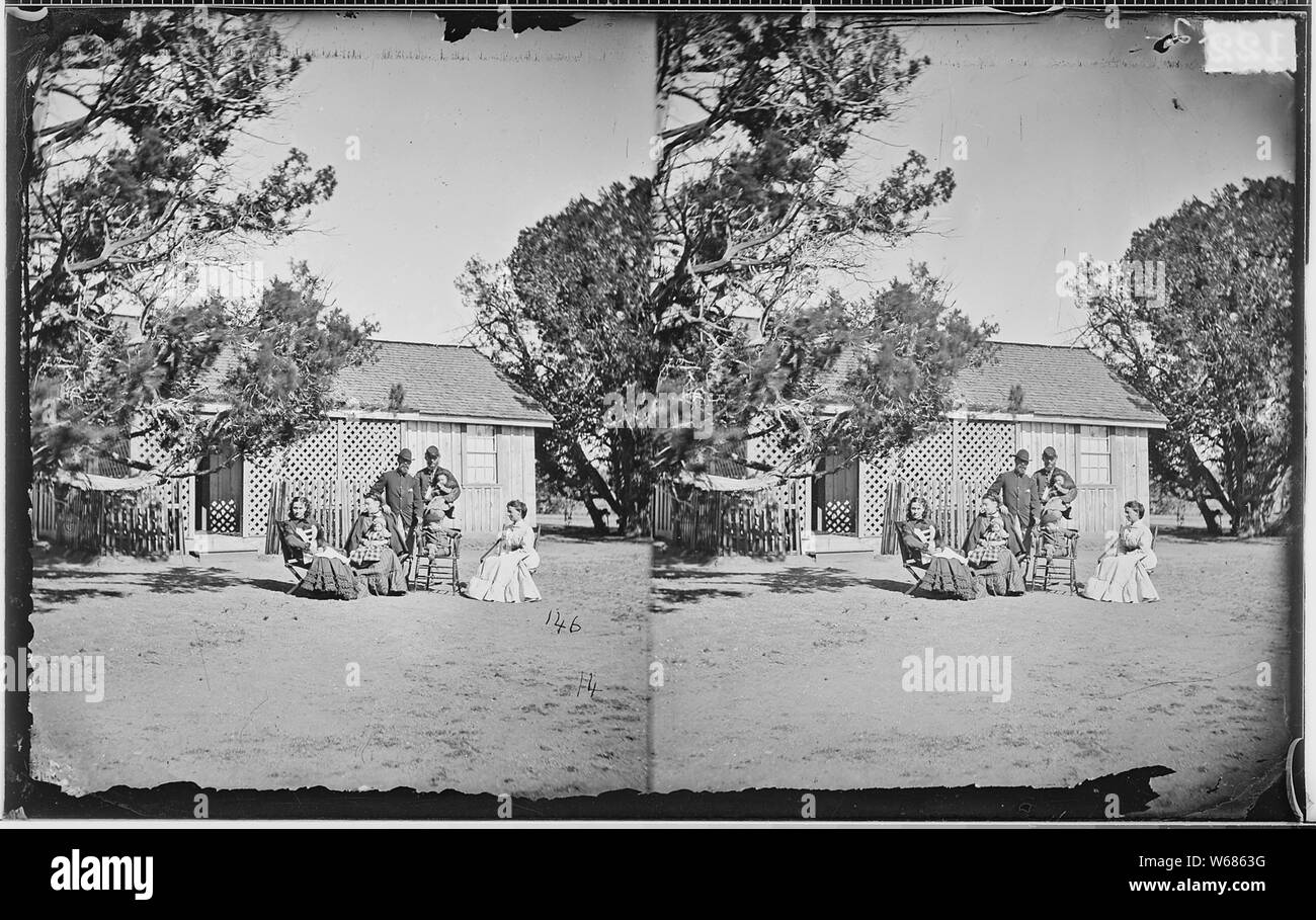SOLDIERS AND WOMEN IN FRONT OF HOUSE Stock Photo - Alamy