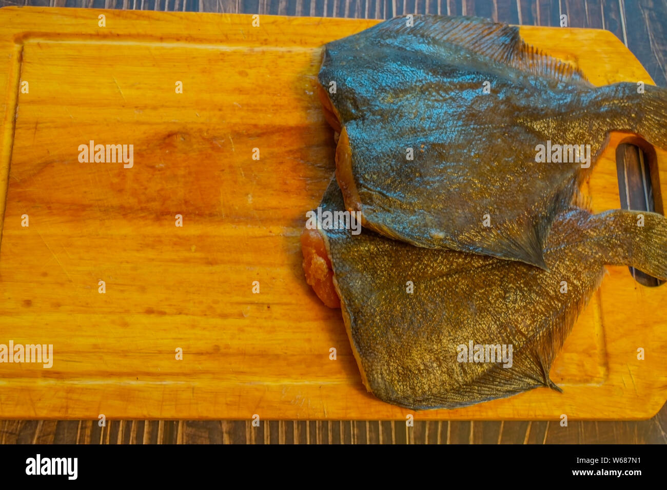 Fresh fish without the head with caviar. Cooked for frying Stock Photo ...