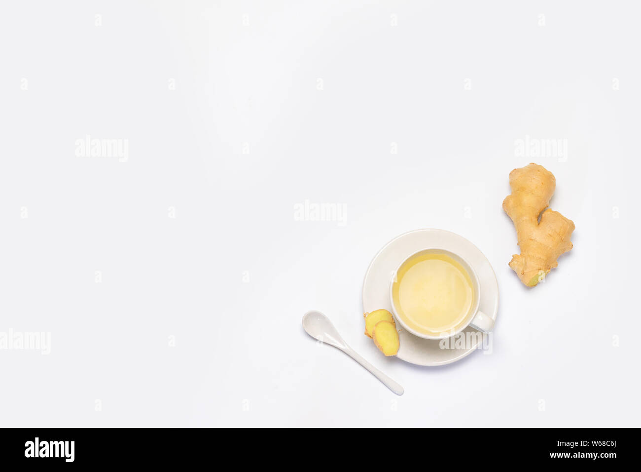 Creative layout of a cup of hot tea with gingeron a white background ...