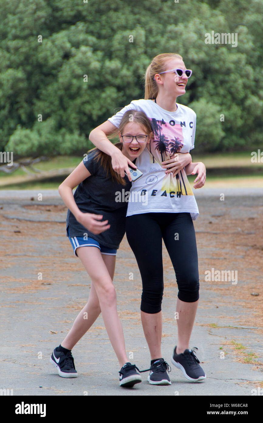 Two happy girls walking in nature and having fun. - image Stock Photo ...