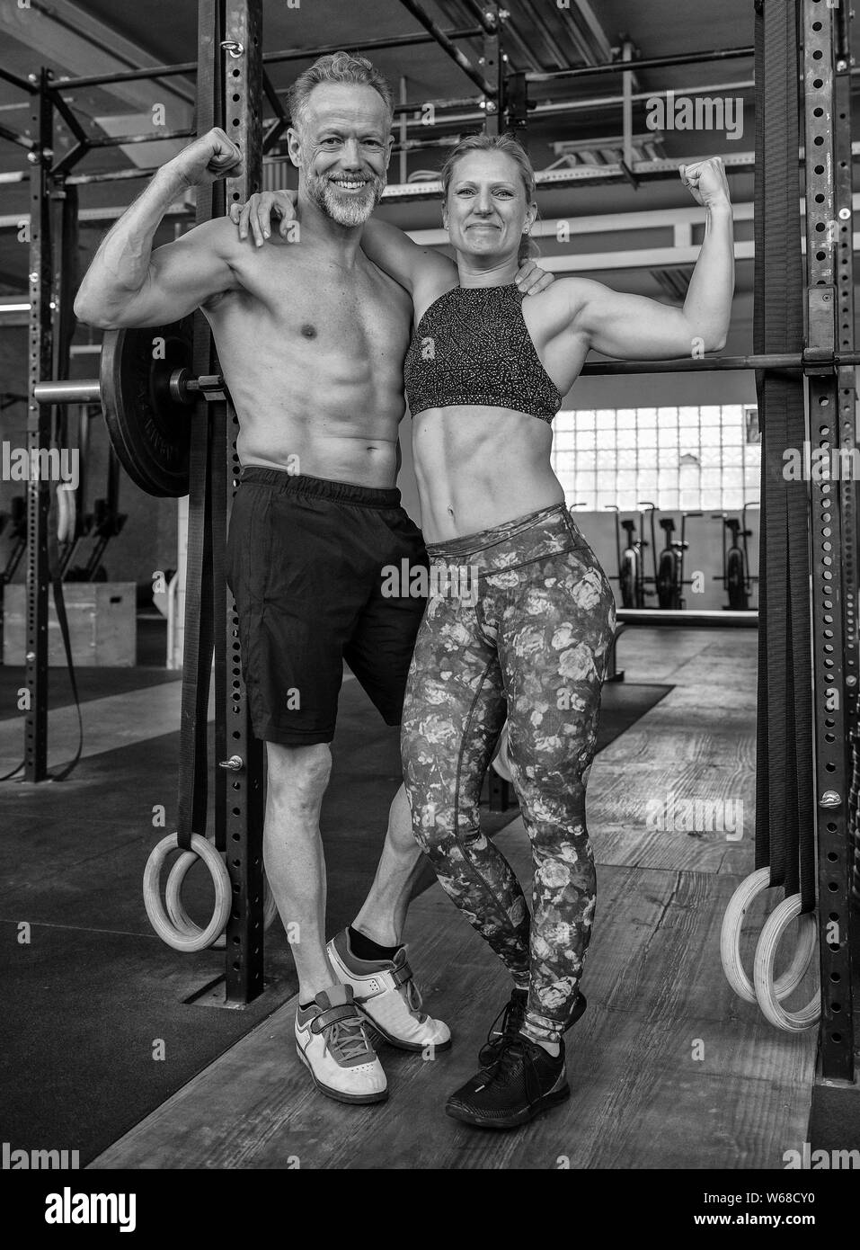 Portrait of a middle aged attractive and athletic couple who is showing ...