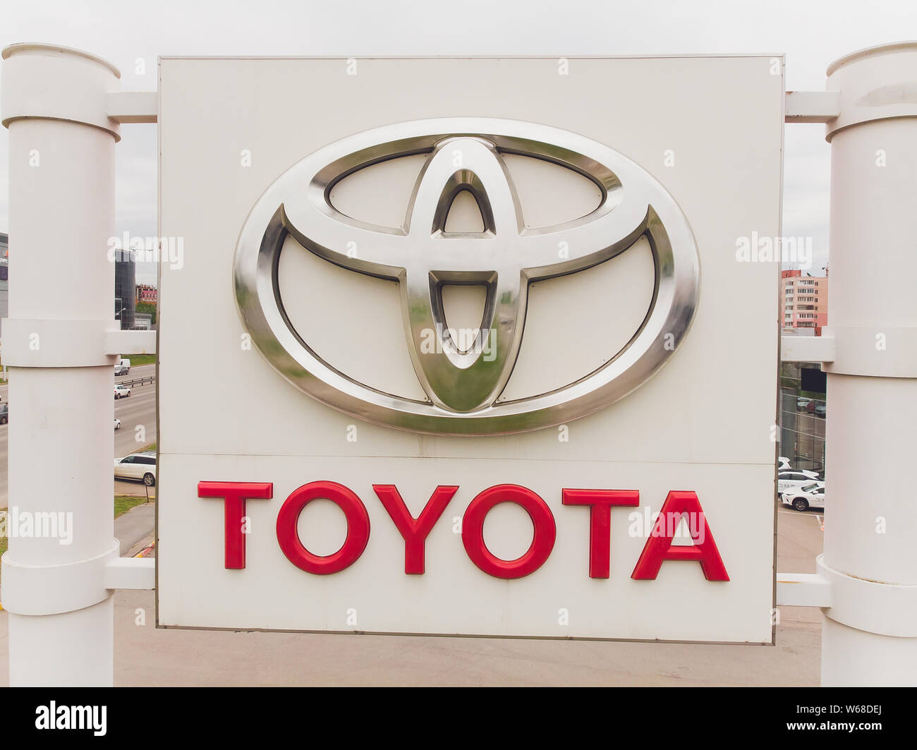 UFA, RUSSIA - August 25, 2018: Toyota dealership sign against blue sky ...