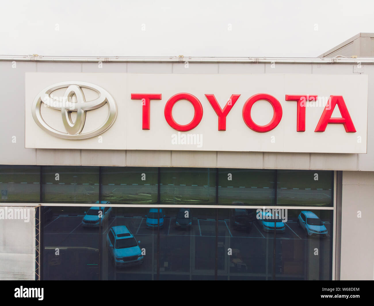 UFA, RUSSIA - August 25, 2018: Toyota dealership sign against blue sky ...