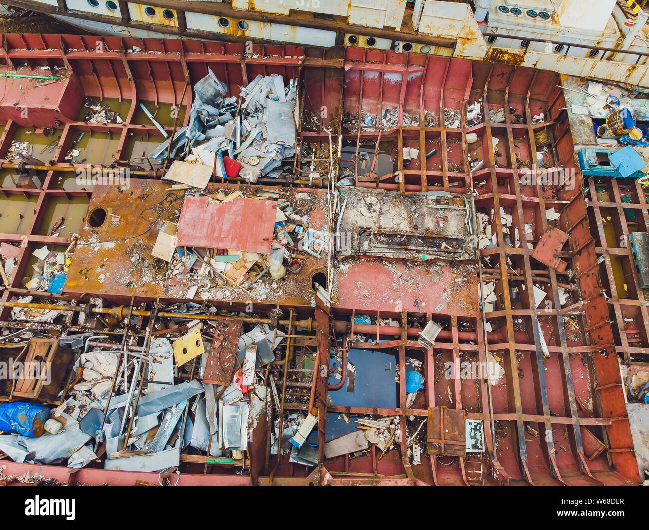 Old boats moored in dirty harbour. Pollution of river, sea, ocean water ...