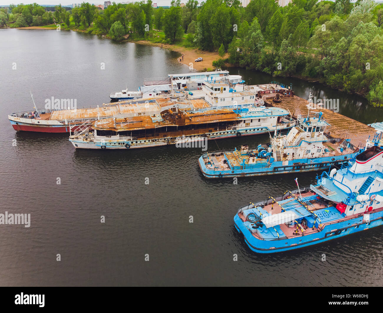 Aerial top view Tugboat, Tanker and container ship parking in shipyard ...