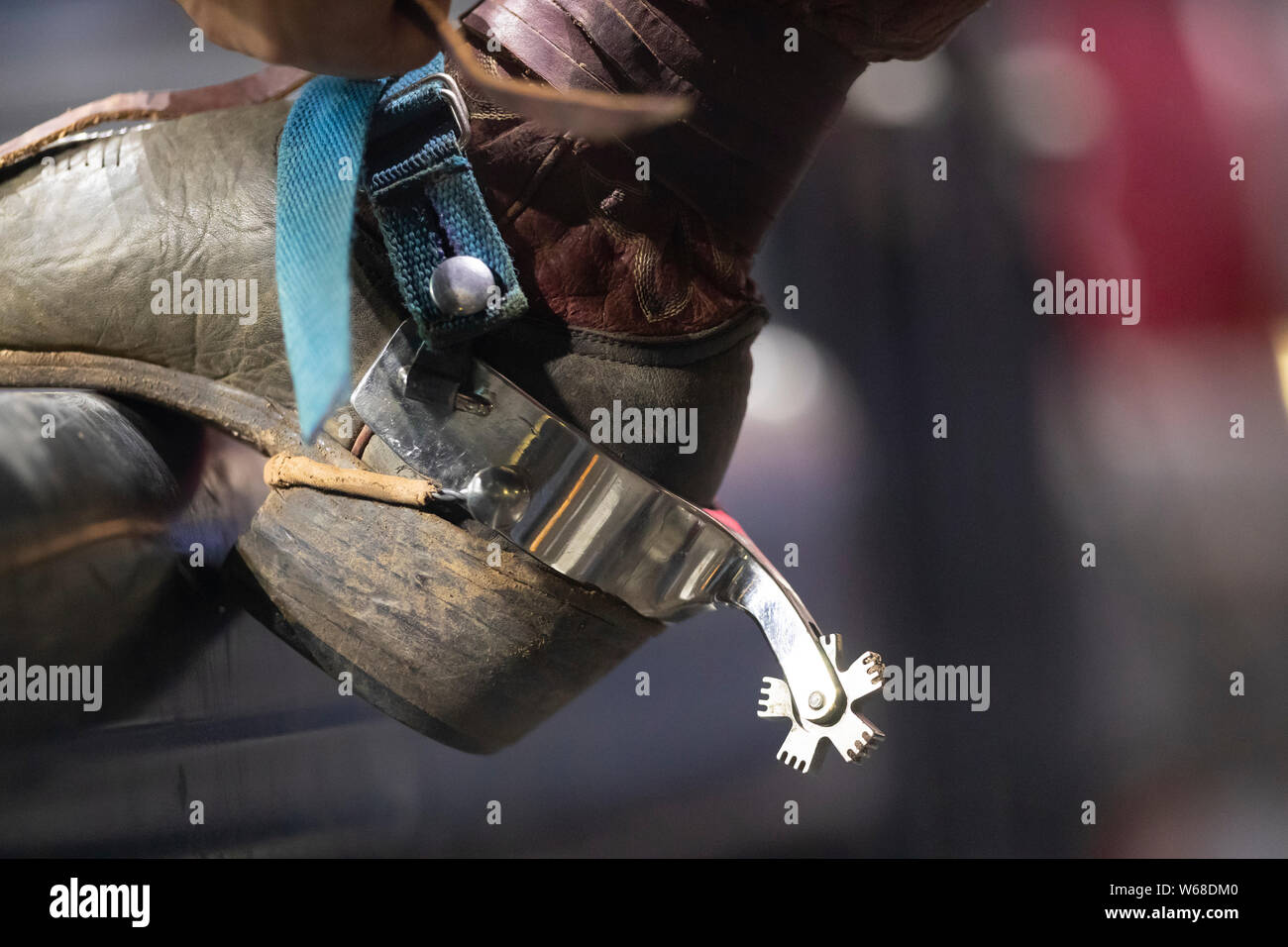 A close up of a cowboy boot and spur on a pipe Stock Photo - Alamy