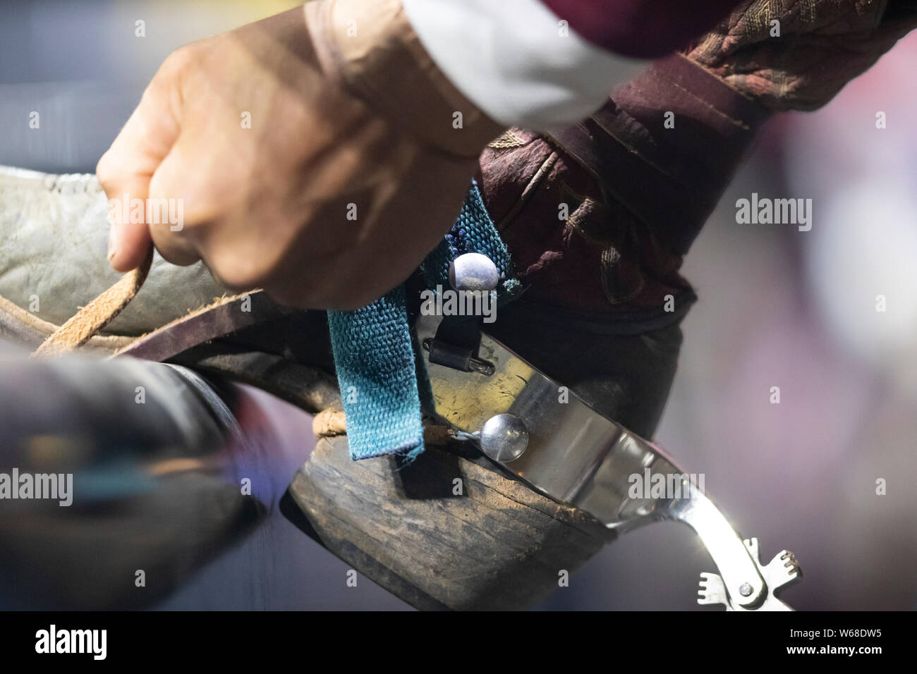 A close up of a cowboy boot and spur on a pipe Stock Photo - Alamy