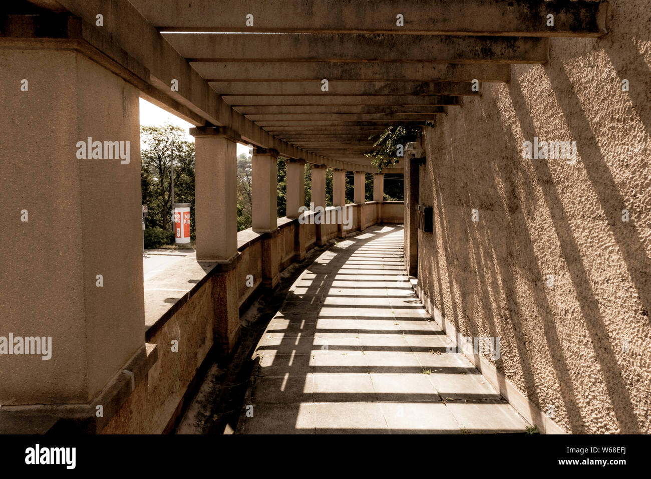 Arcade corridor with shade and columns at an old house in Stuttgart ...