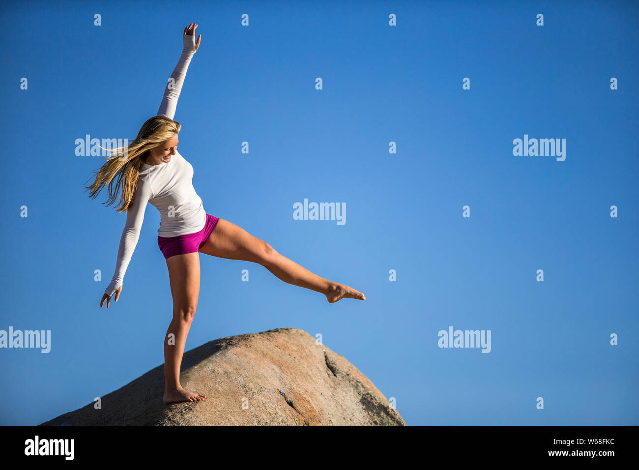 Woman standing barefoot on a rock hi-res stock photography and images ...