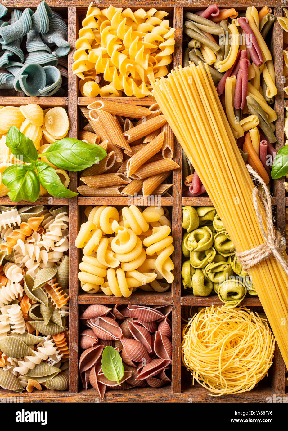 Assorted colorful italian pasta in wooden box Stock Photo - Alamy