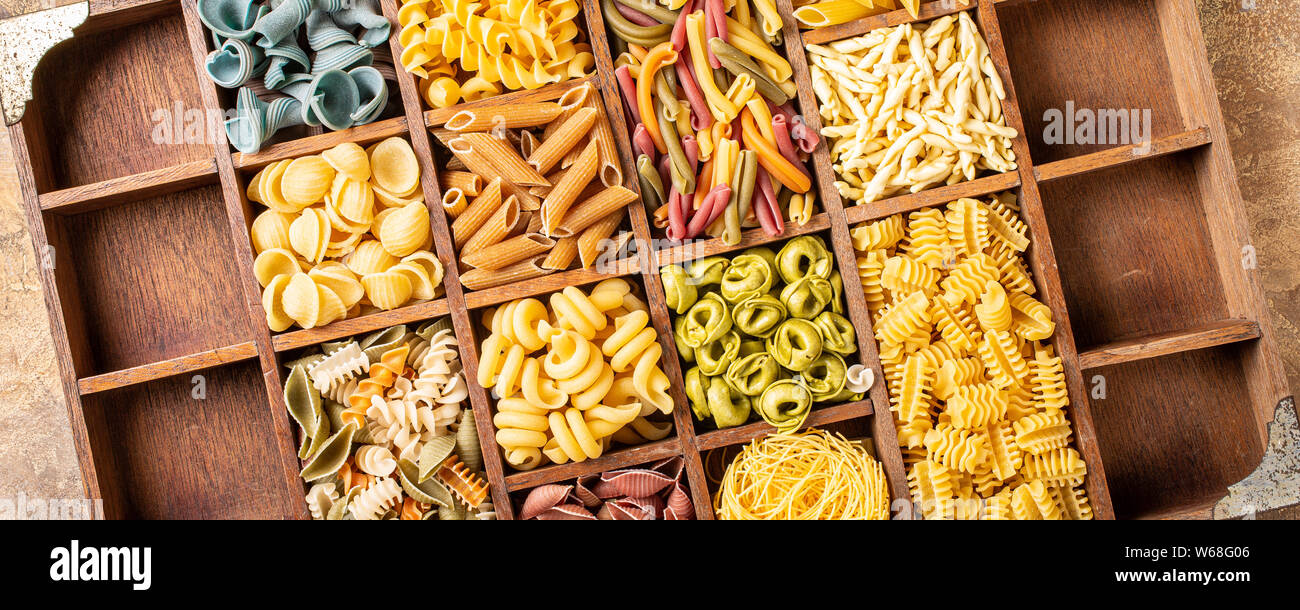 Assorted colorful italian pasta in wooden box Stock Photo - Alamy