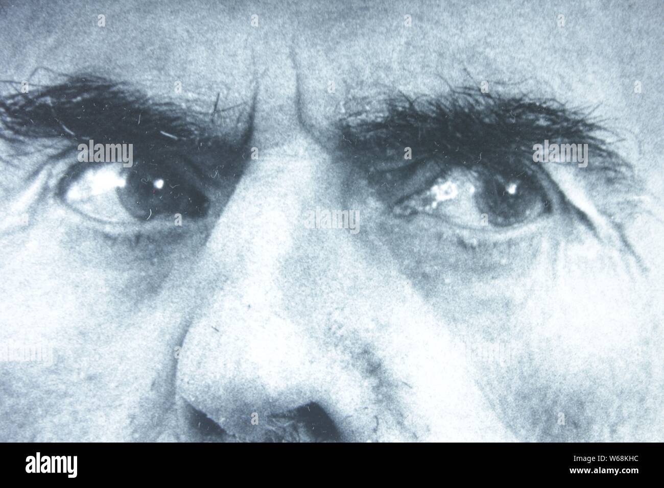 Fine black and white art photography portrait of a cautious man from ...