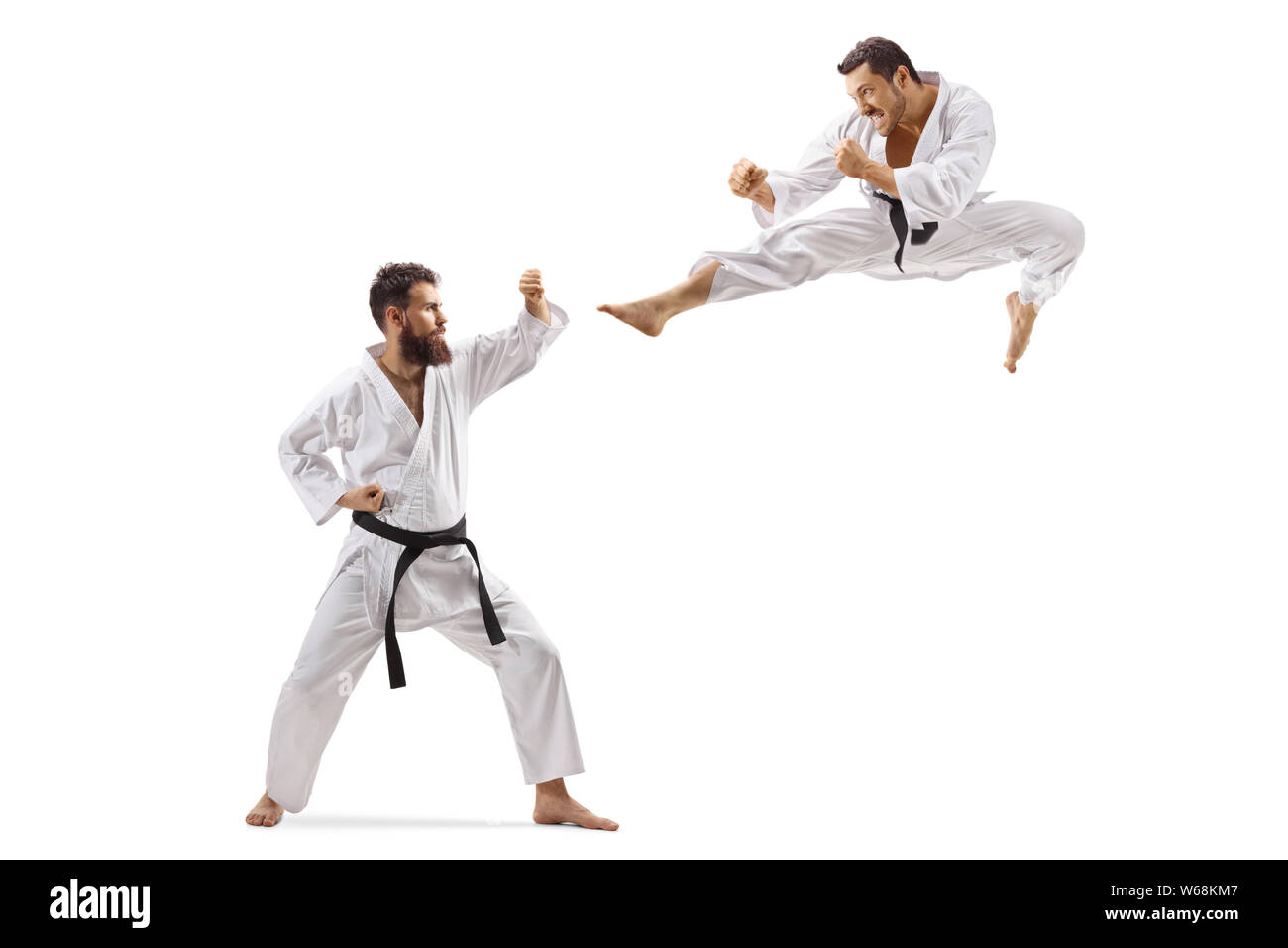 Full length shot of a two men in kimono fighting isolated on white ...