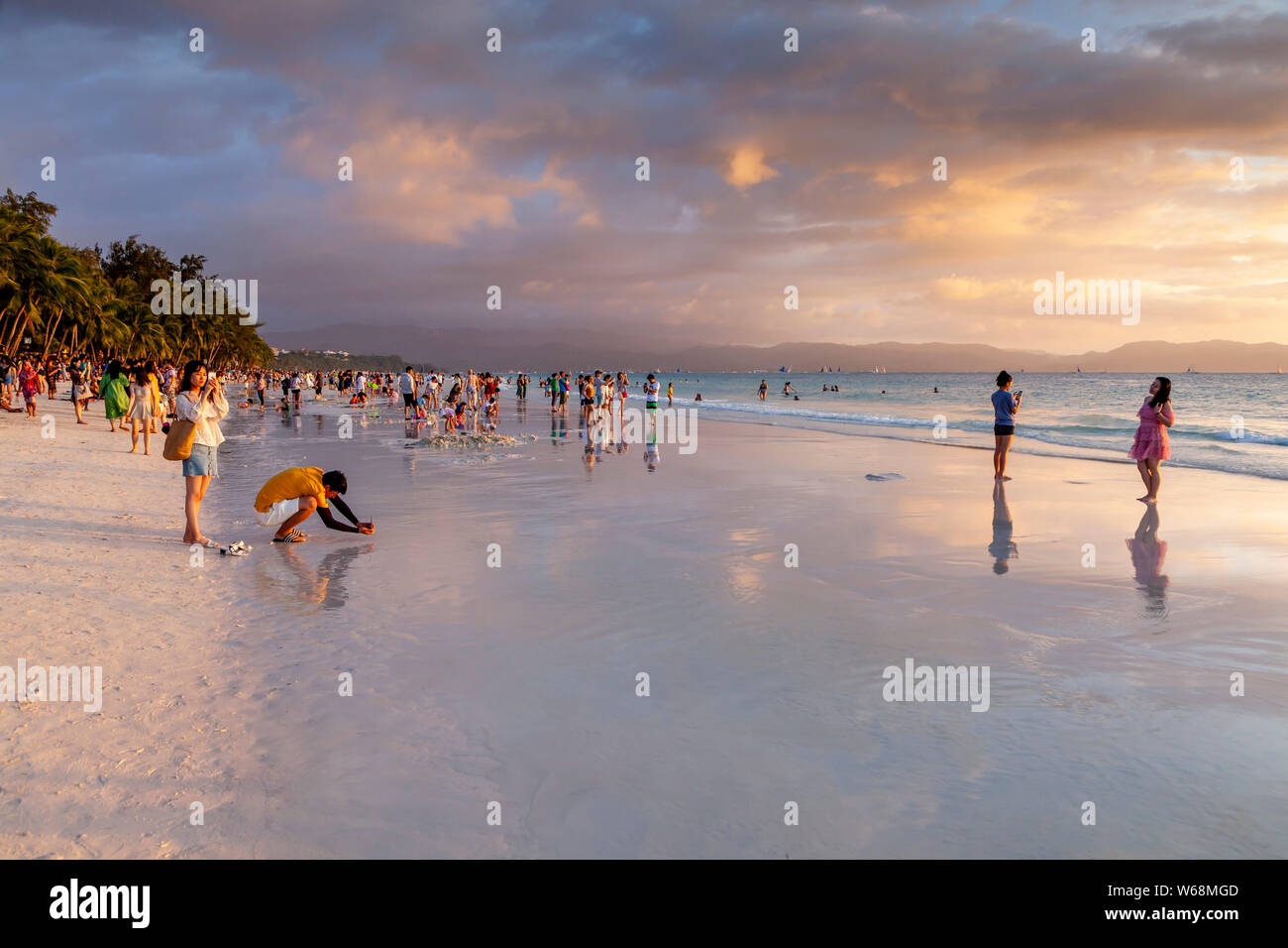 Tourists Gather To Watch The Sunset On White Beach, Boracay, Aklan ...