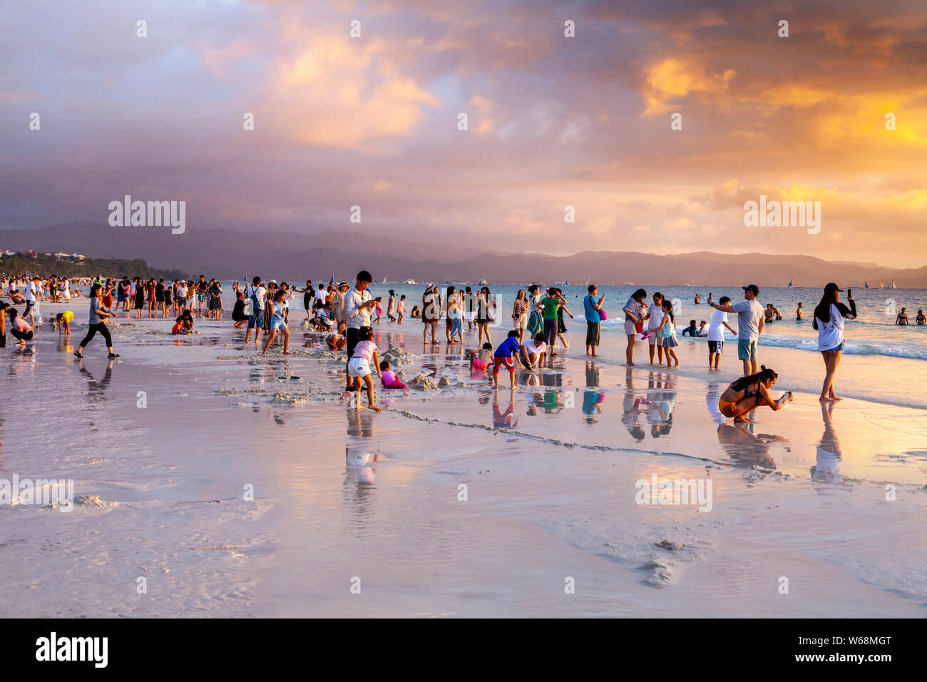 Tourists Gather To Watch The Sunset On White Beach, Boracay, Aklan ...