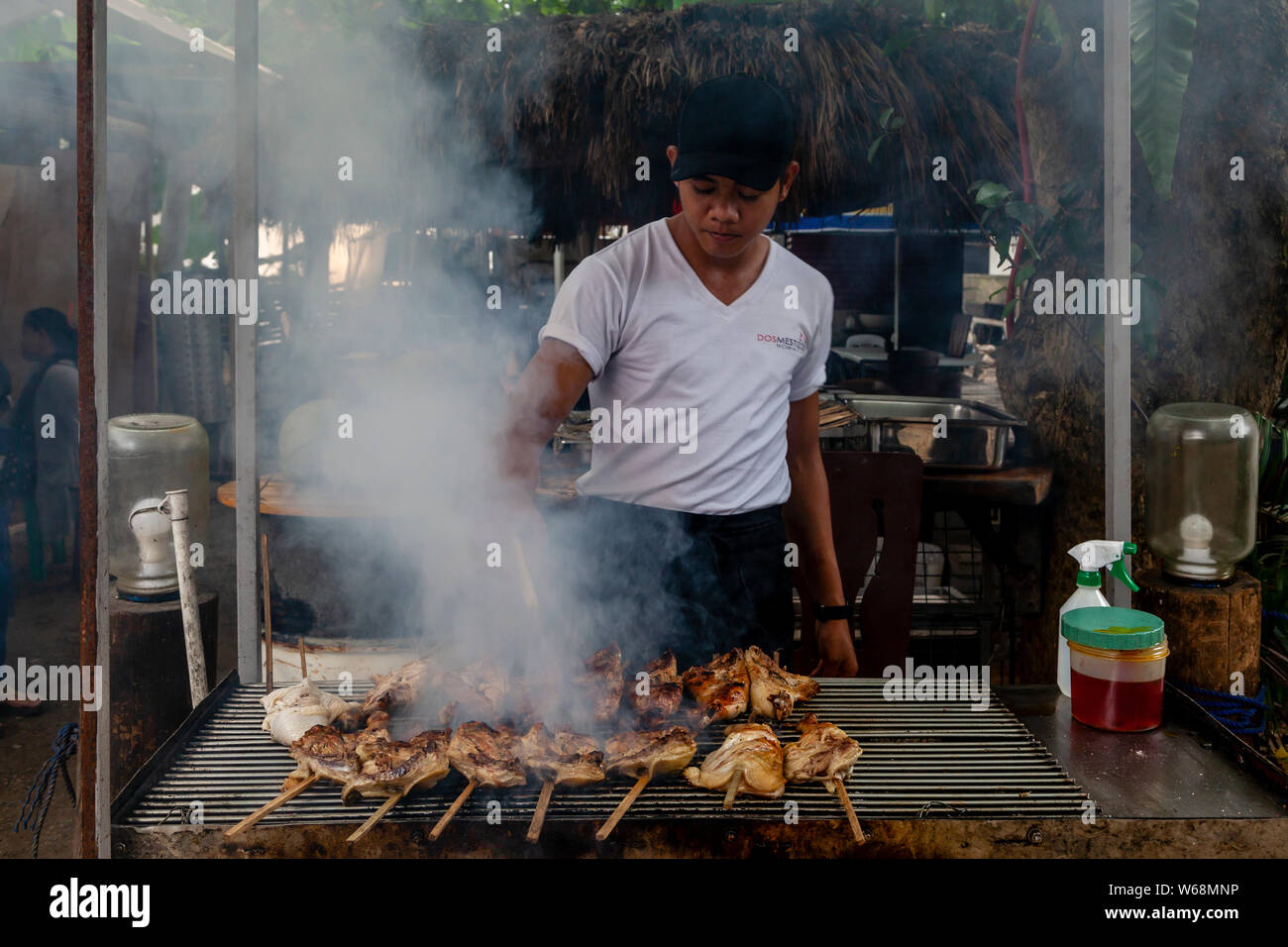 A Man Cooks Meat On A Barbecue, Boracay, Aklan Province, The ...