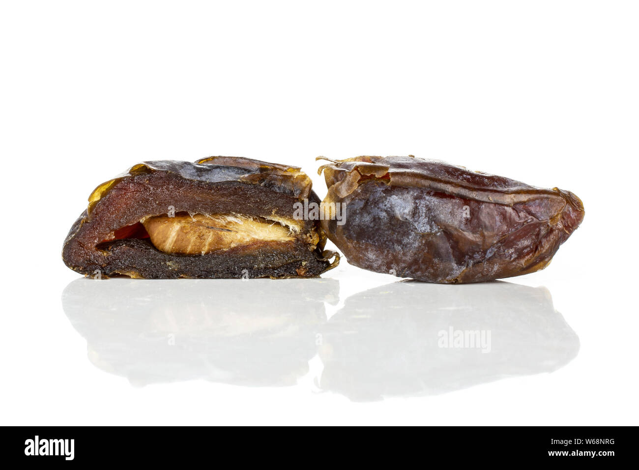 Group of one whole one half of dried brown date medjool isolated on ...