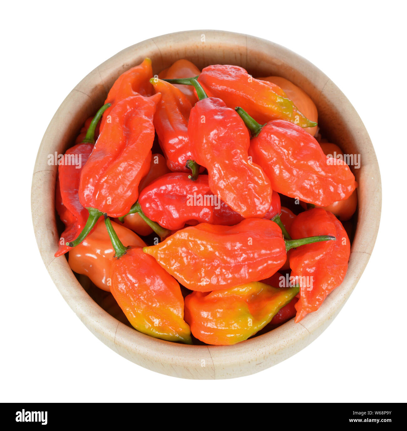 bhut jolokia: hottest pepper from chile in wooden bowl isolated on ...