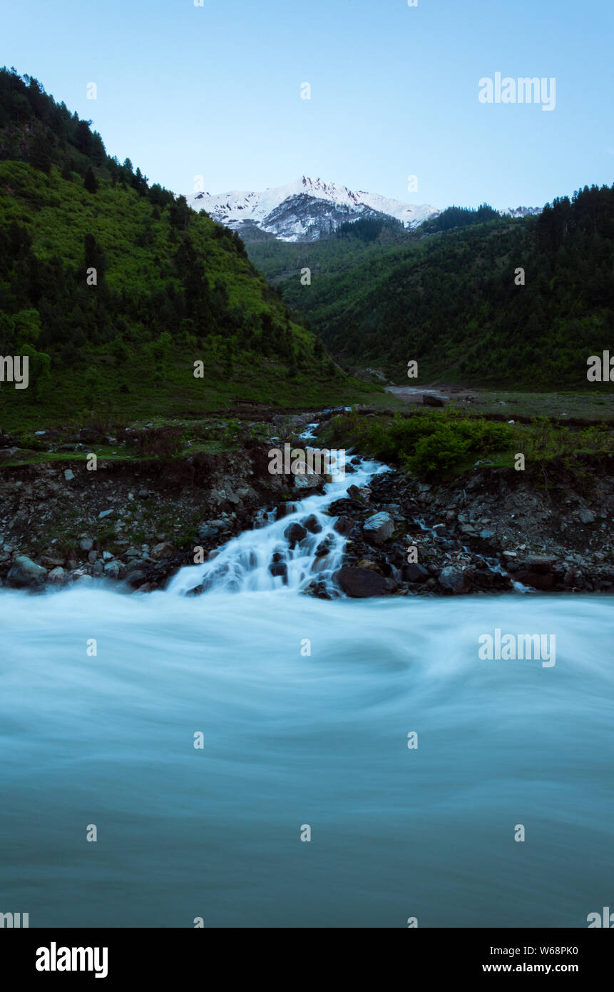Beautiful, scenic view of river formed from melting snow flowing into ...