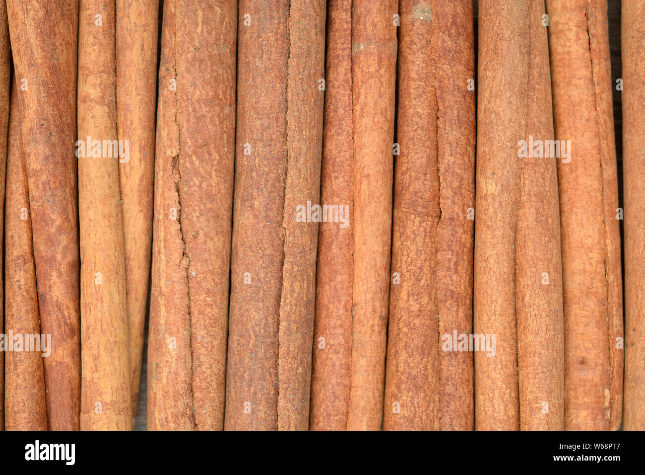 cinnamon sticks and texture for background uses Stock Photo - Alamy