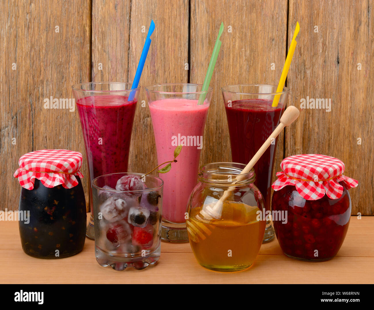 Set of berry smoothies, jams and frozen berries Stock Photo - Alamy