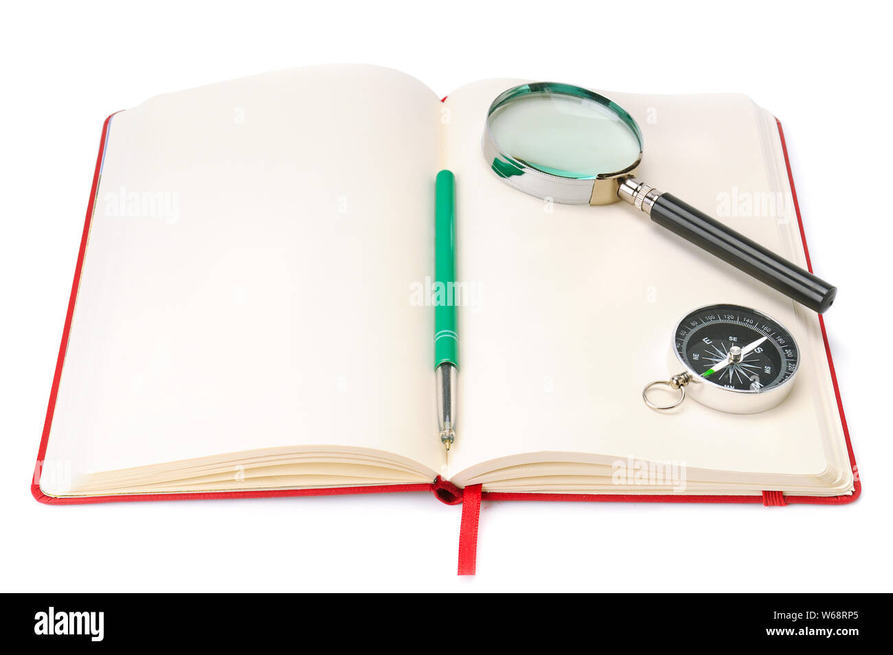 Notebook, magnifying glass and compass isolated on white background ...