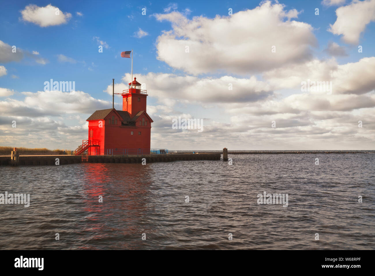 Autumn morning clouds pass over the Holland Harbor Lighthouse known as ...