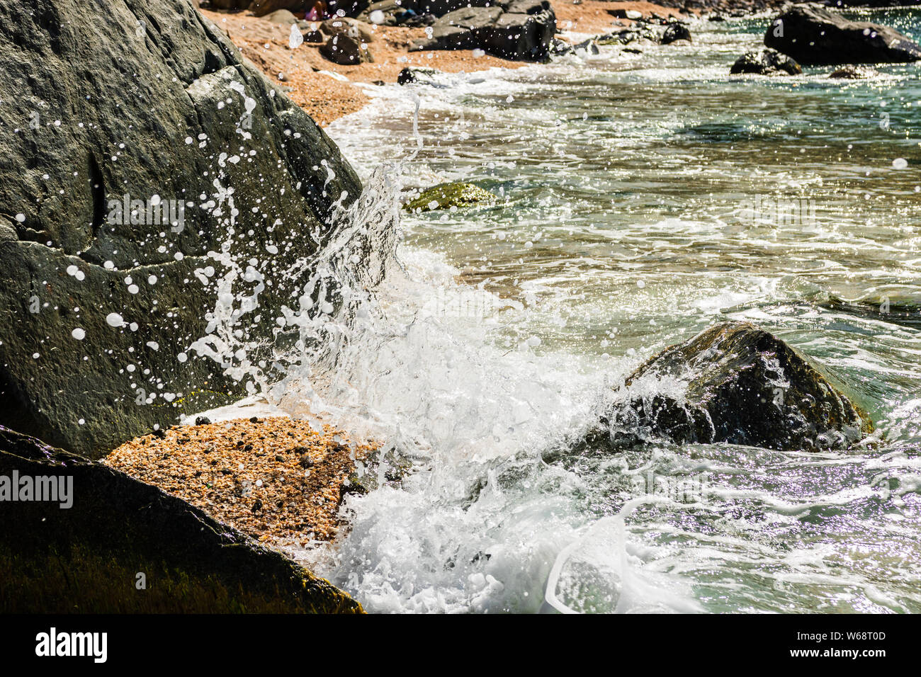Water splashing on the rocks of the famous Shell Beach, in St. Barth’s ...