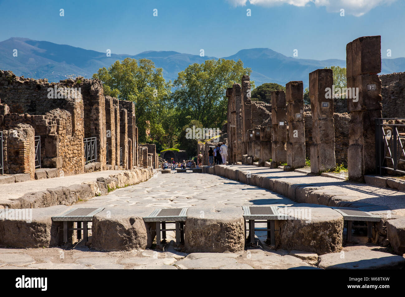 The streets of Pompeii made of large blocks of black volcanic rocks ...