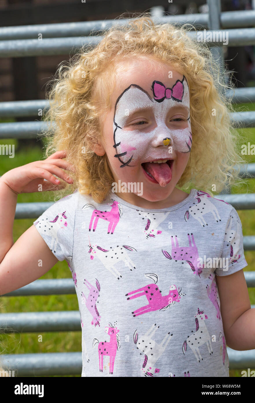 Child poking tongue hi-res stock photography and images - Alamy