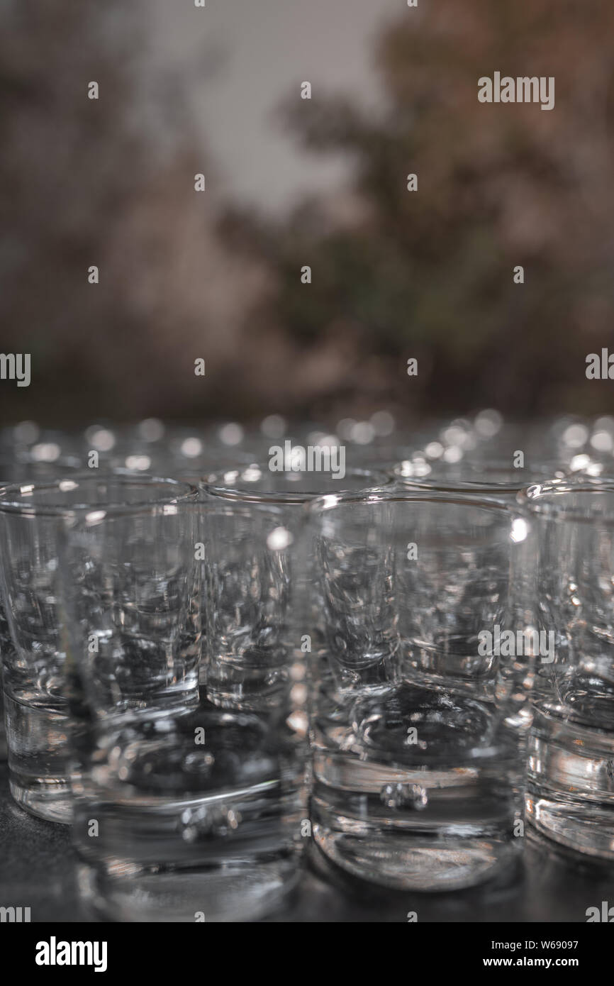 Vertical image of many glass glasses in a bar - Luxurious and shiny ...