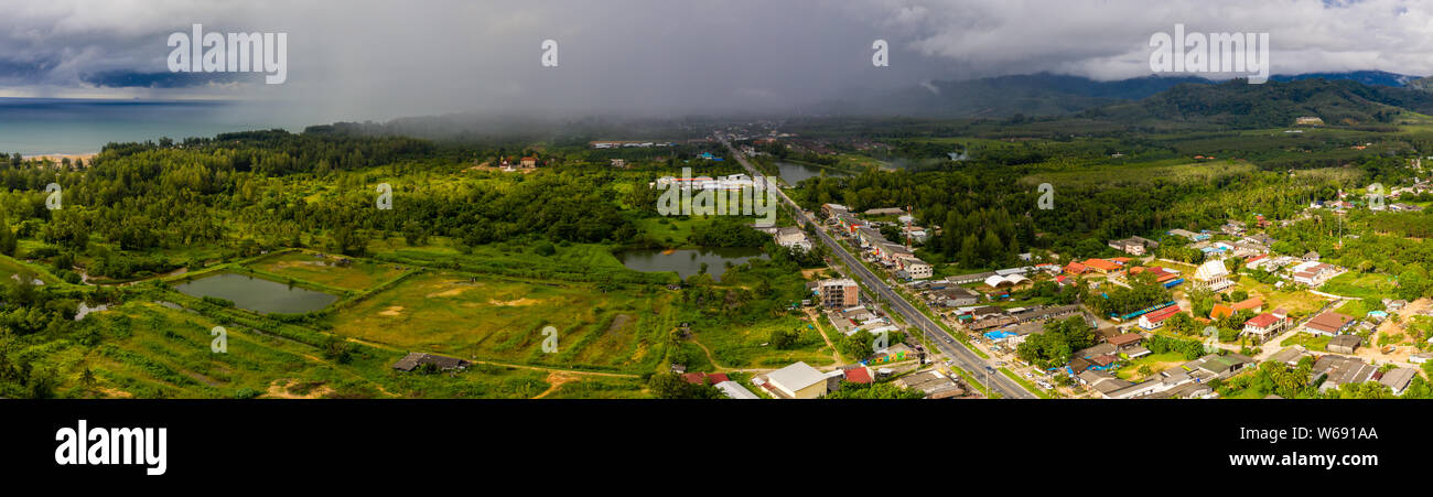 Aerial panorama of an approaching rain and thunderstorm in the tropics ...