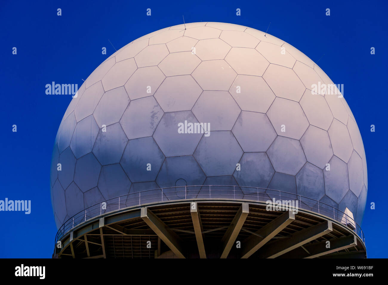 Image of white radar station with hexagon surface and blue sky Stock ...