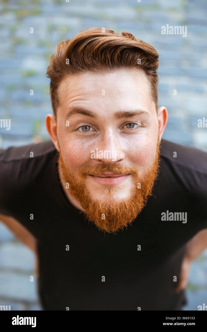 Portrait of an attractive redhead man with a beard. Close-up of a ...