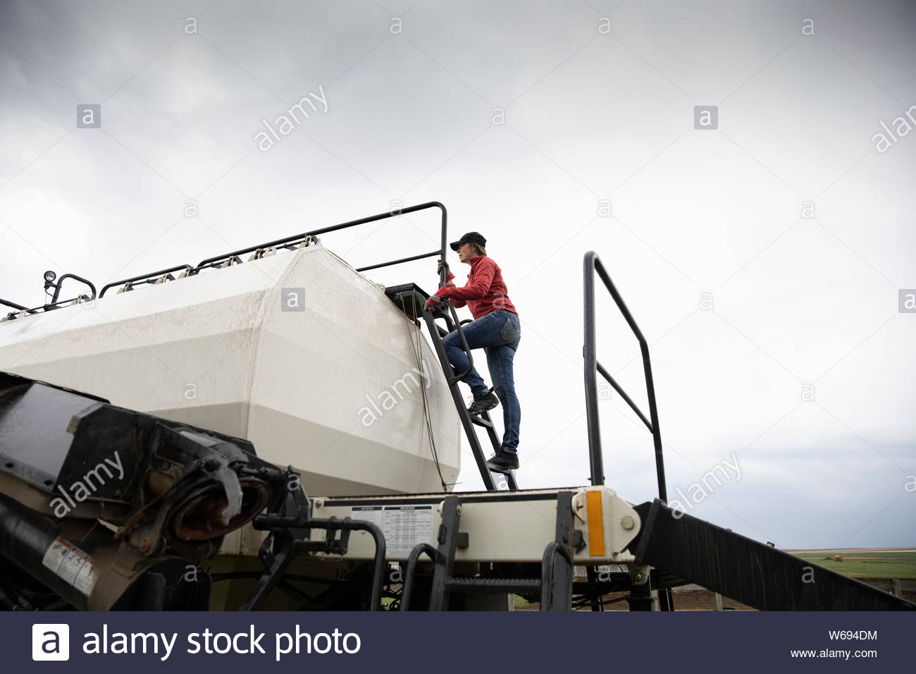 Women climbing ladder hi-res stock photography and images - Alamy