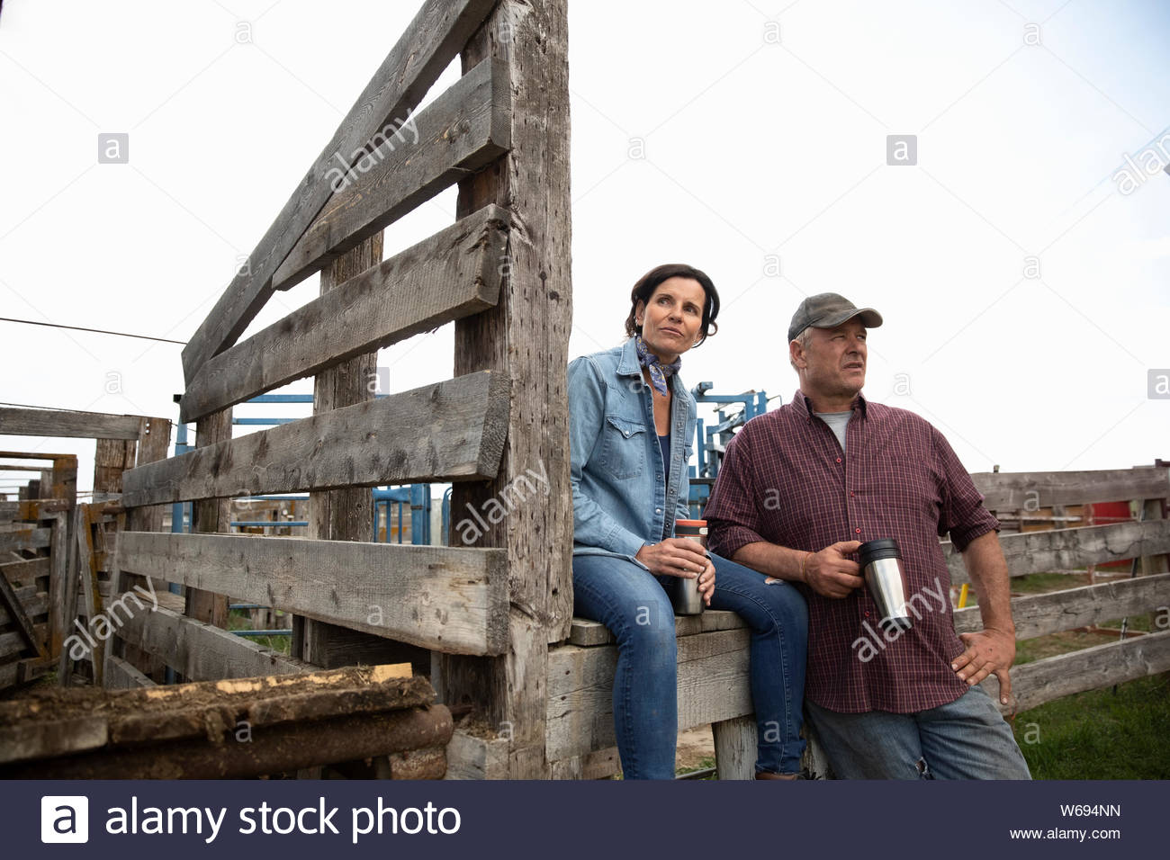 Farmer couple taking coffee break on farm Stock Photo - Alamy