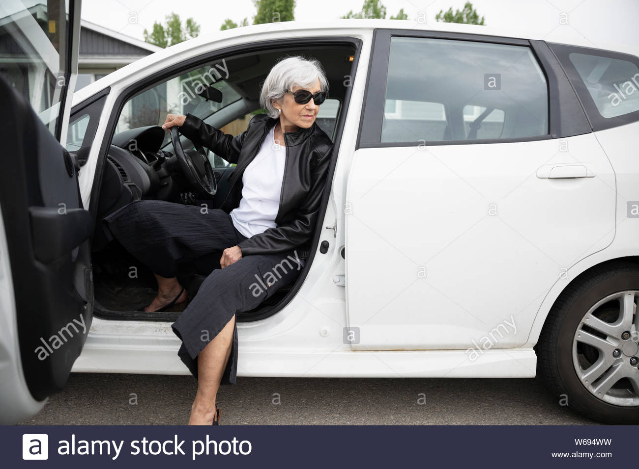 Woman leaning over car hi-res stock photography and images - Alamy