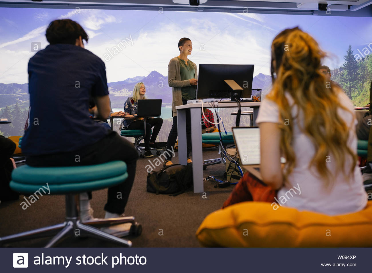 Teacher in VR class talking to students Stock Photo - Alamy