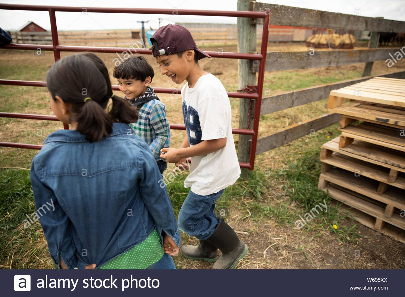 Kids walking on ranch Stock Photo - Alamy