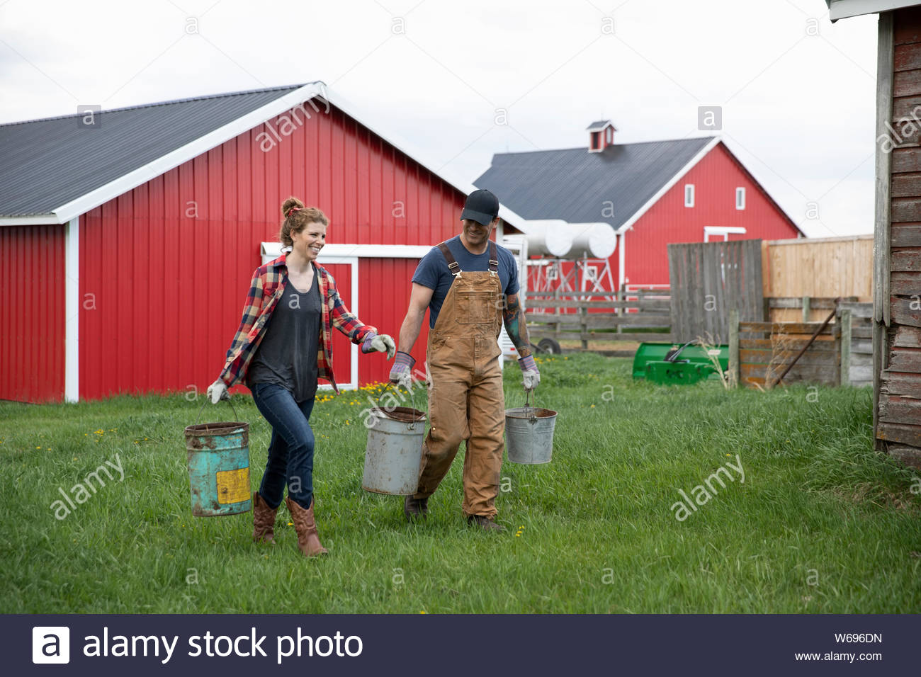 Men carrying buckets hi-res stock photography and images - Alamy